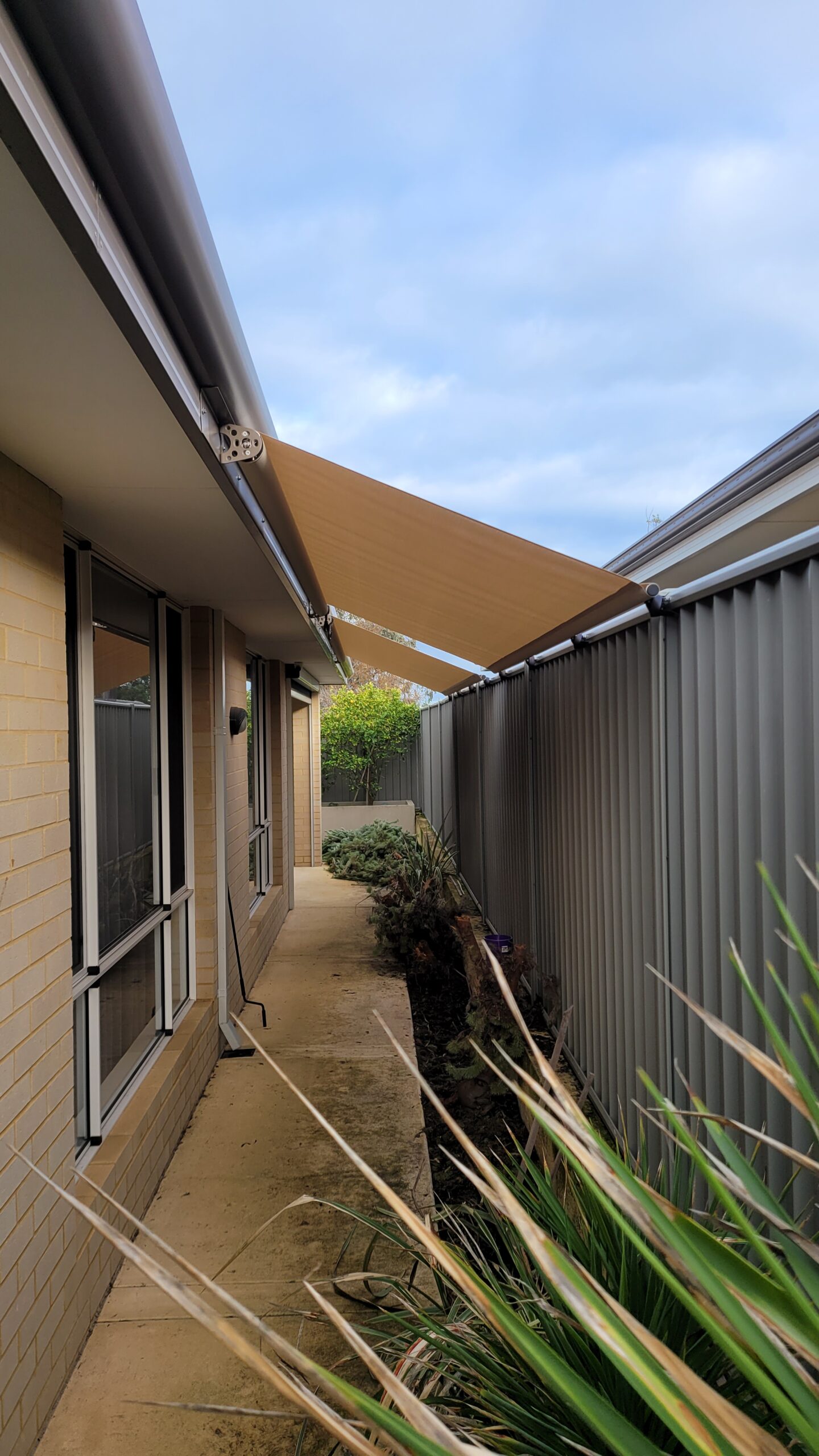Success | Back Yard Roof To Fence Blind Installation